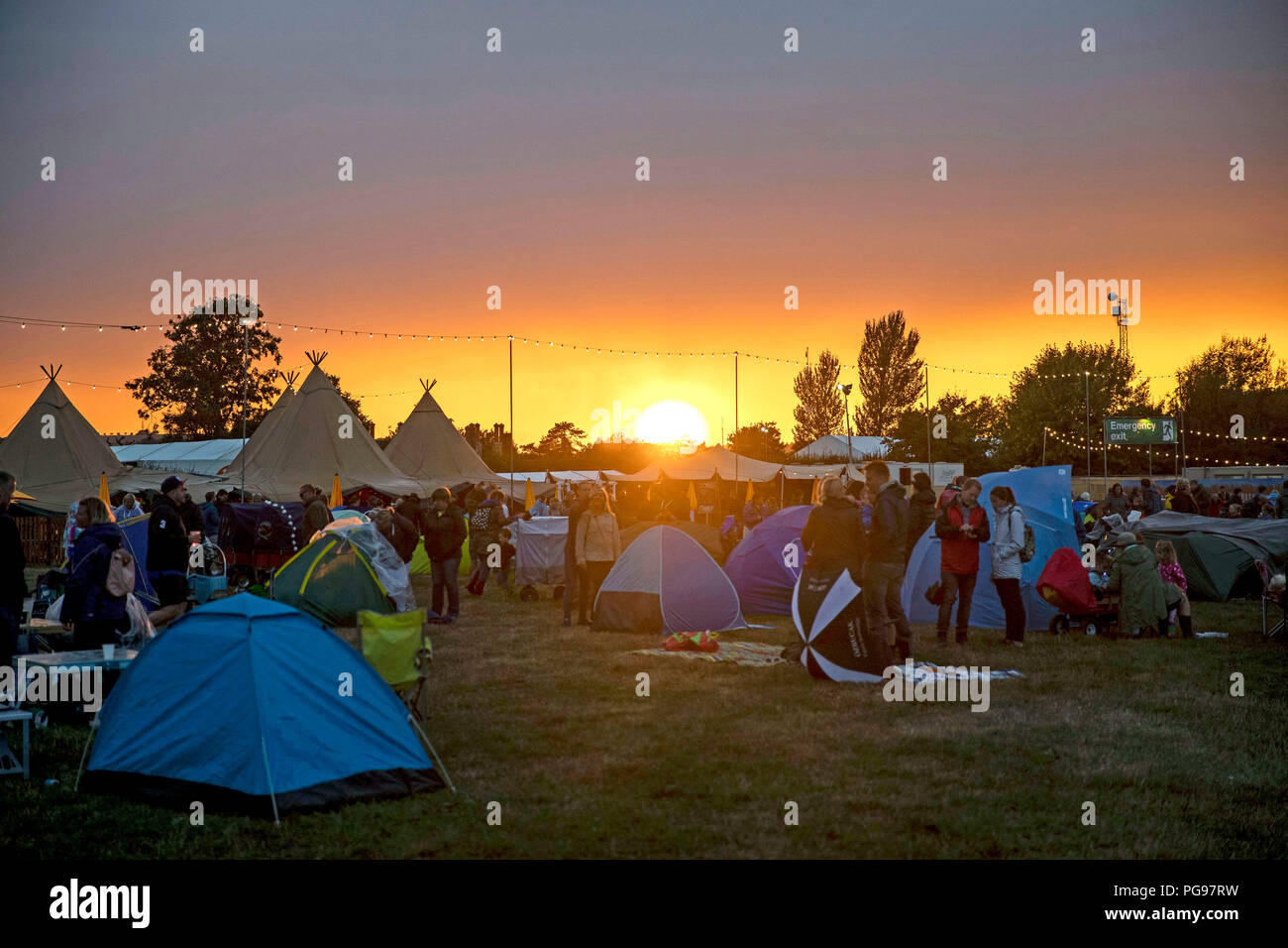 The sun sets during the Big Feastival at Alex James' farm in Kingham ...