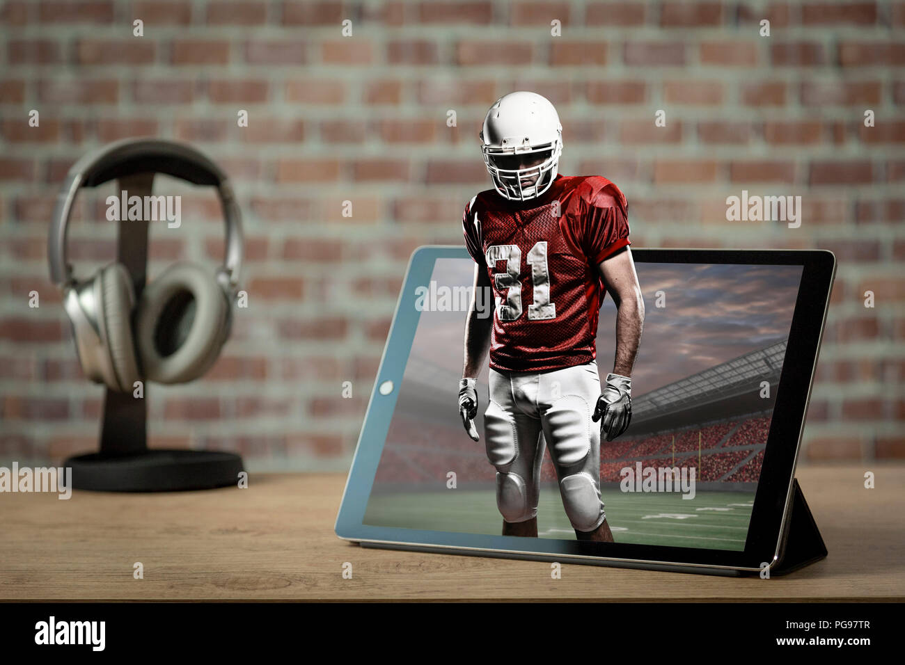 Football Player with a red uniform Playing playing and coming out of a ...