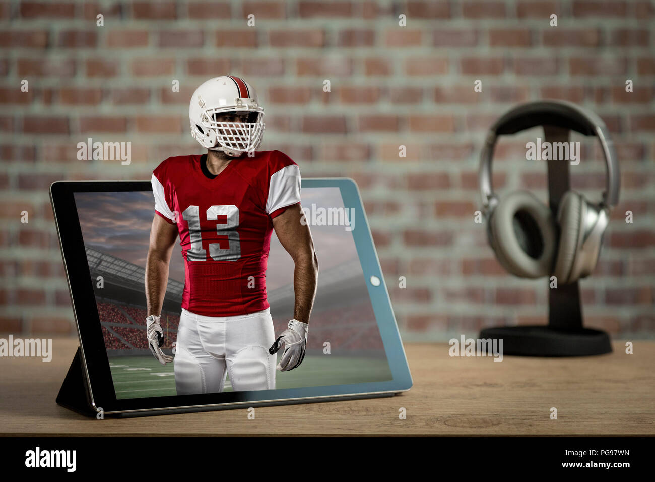 Football Player with a red uniform Playing playing and coming out of a ...