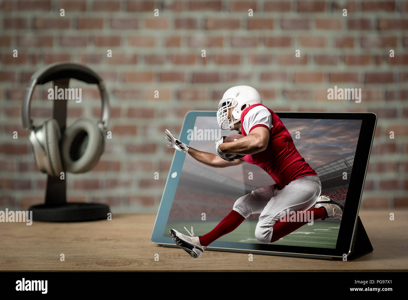 Football Player with a red uniform Playing playing and coming out of a ...