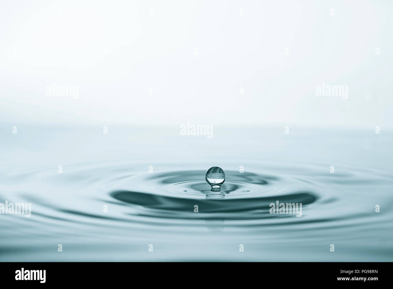 Water drop impact Stock Photo - Alamy