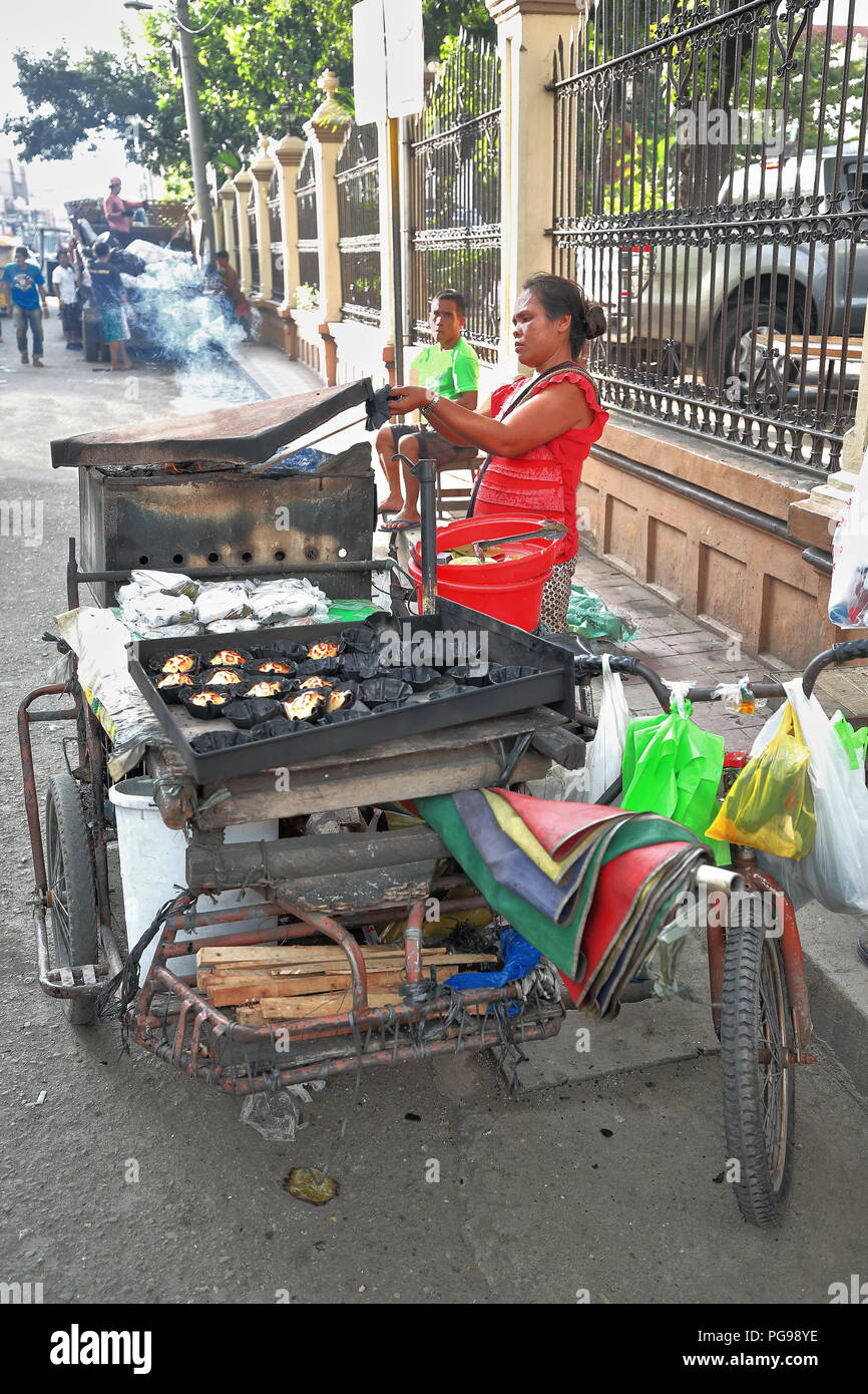 Cebu, Philippines-October 18, 2016: Streetfood saleswoman cooks and ...