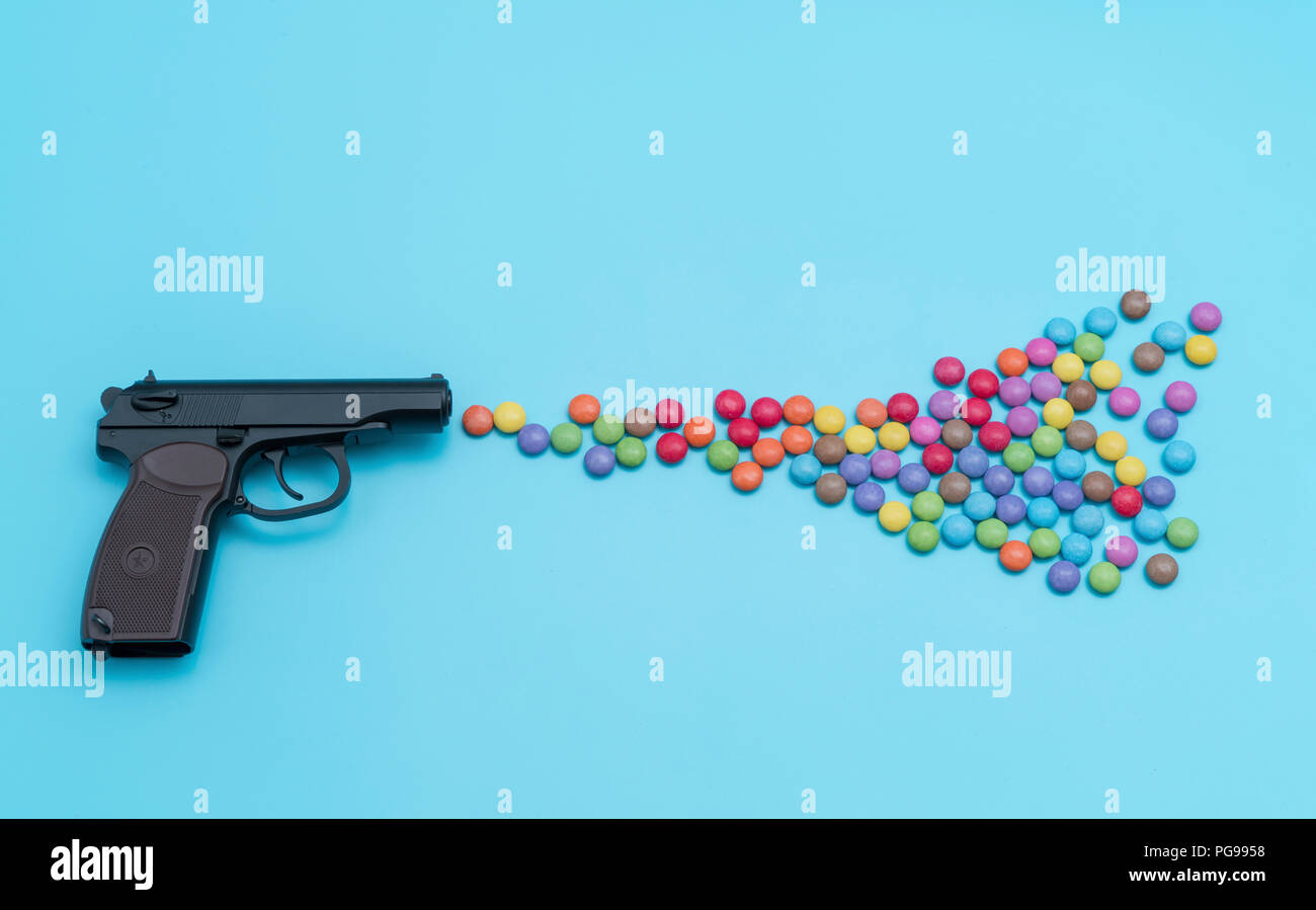 Pistol shooting sweets Stock Photo - Alamy