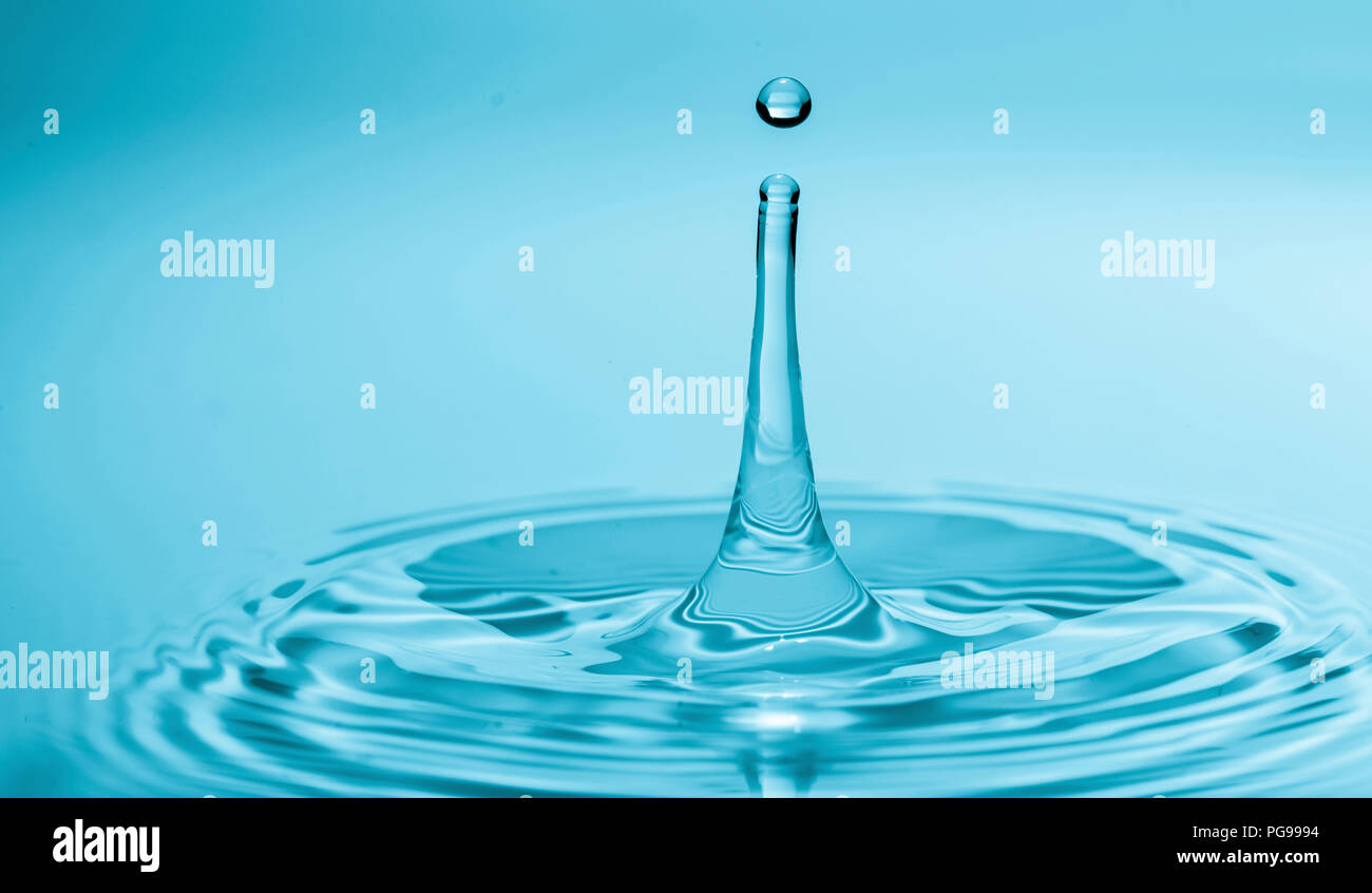 Water drop impact Stock Photo - Alamy