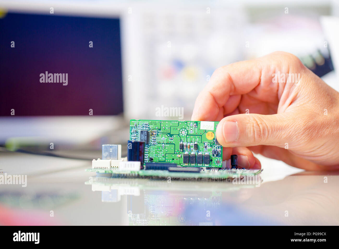 Assembling electronics device Stock Photo - Alamy