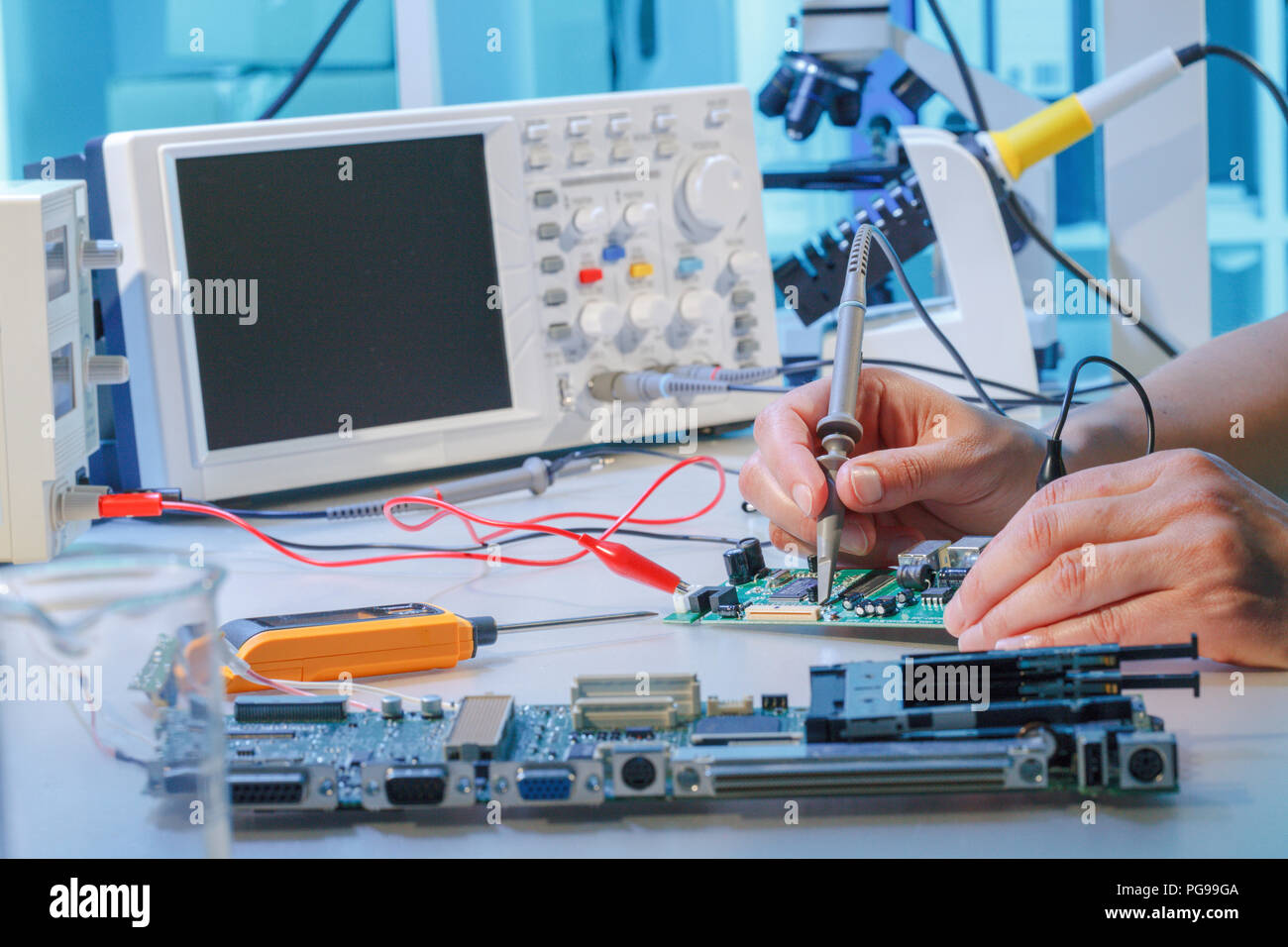 Repairing printed circuit board Stock Photo - Alamy