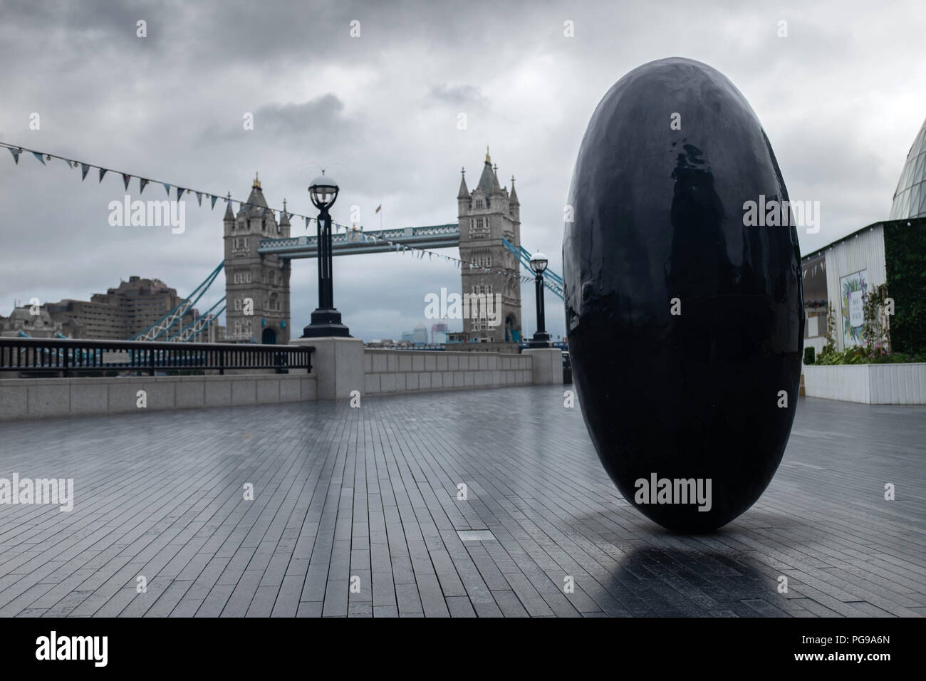 Sculpture in front of Tower Bridge in central London, UK Stock Photo ...