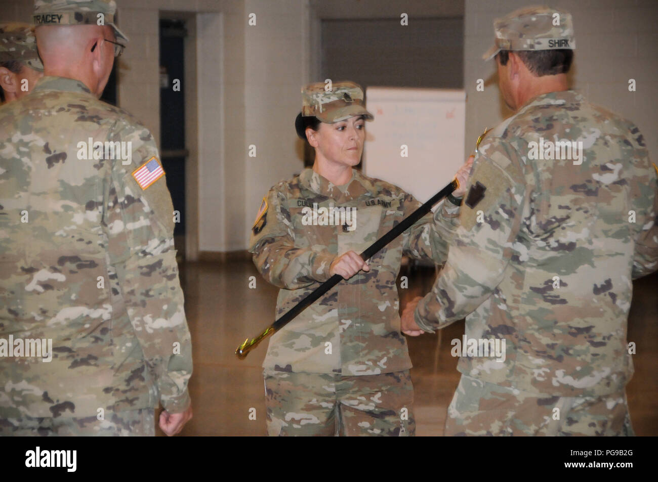 Command Sgt. Maj. Shannon Cullen passes the non-commissioned officer ...