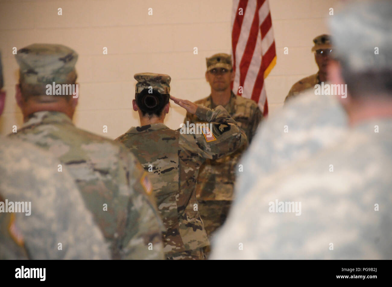 Command Sgt. Maj. Shannon Cullen salutes the battlion commander, Lt ...