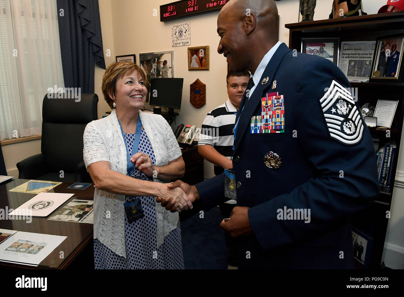 Chief Master Sgt. of the Air Force Kaleth O. Wright greets Connie Russo ...