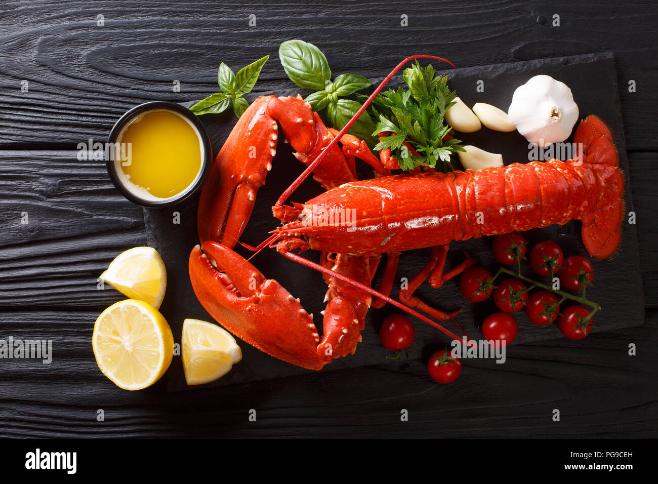 Expensive organic food: boiled lobster with lemon, garlic, fresh ...