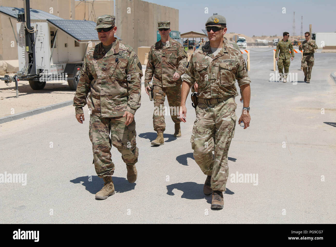 U.S. Army Col. Michael Maddox, Al Asad Air Base commander, speaks with ...