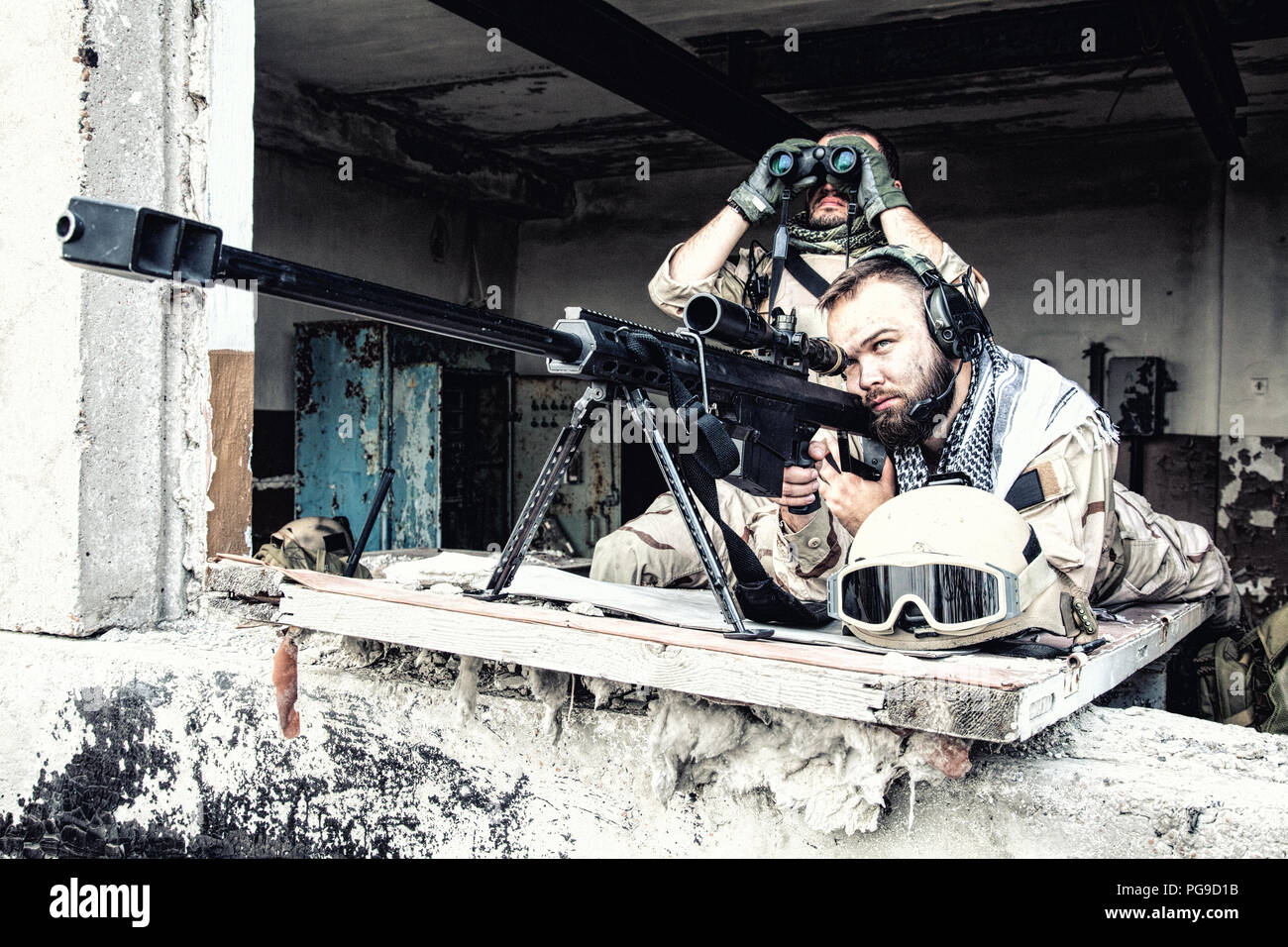 Sniper team with large caliber rifle in ambush Stock Photo - Alamy