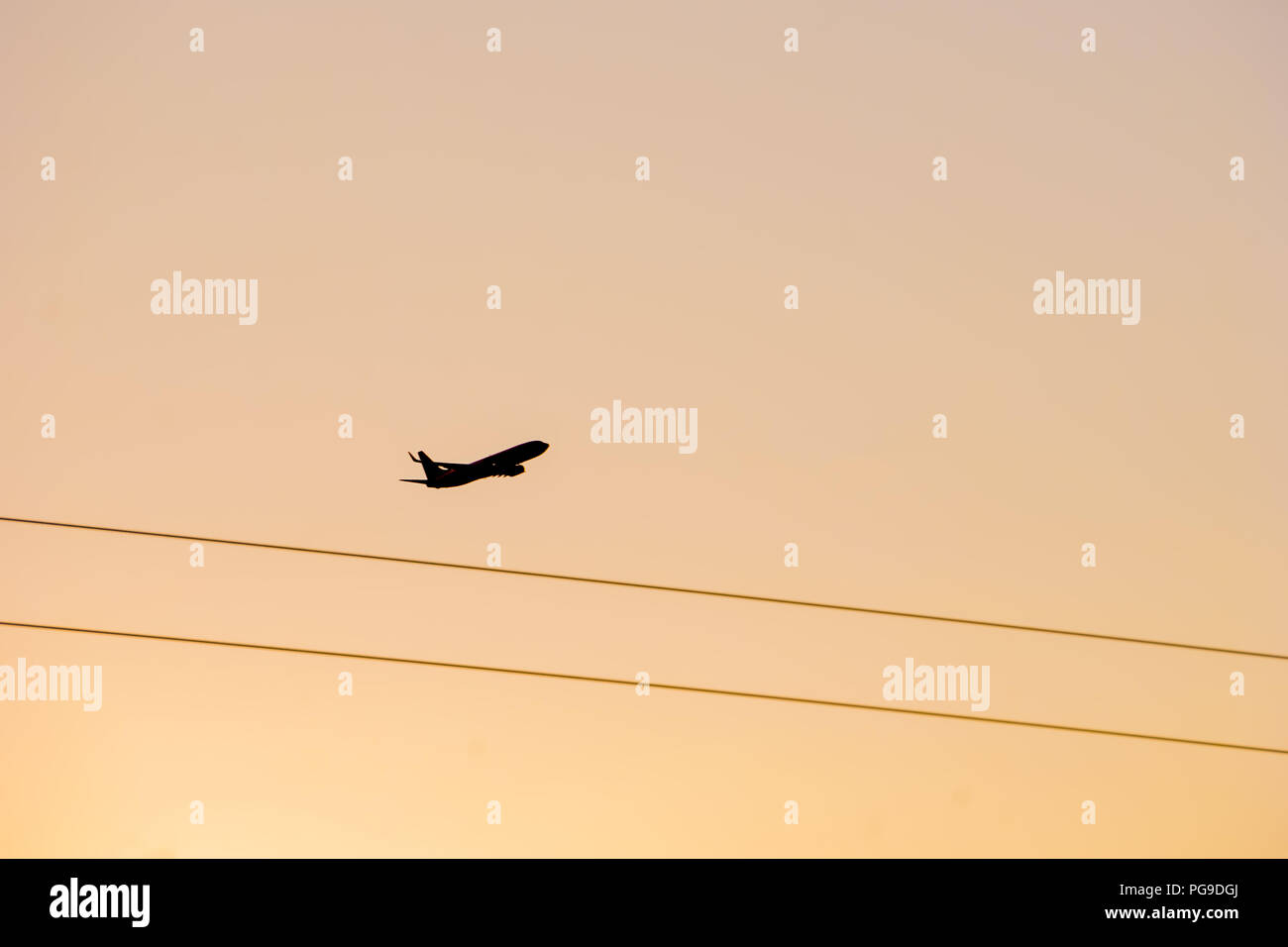 Airplane and electric wires hi-res stock photography and images - Alamy