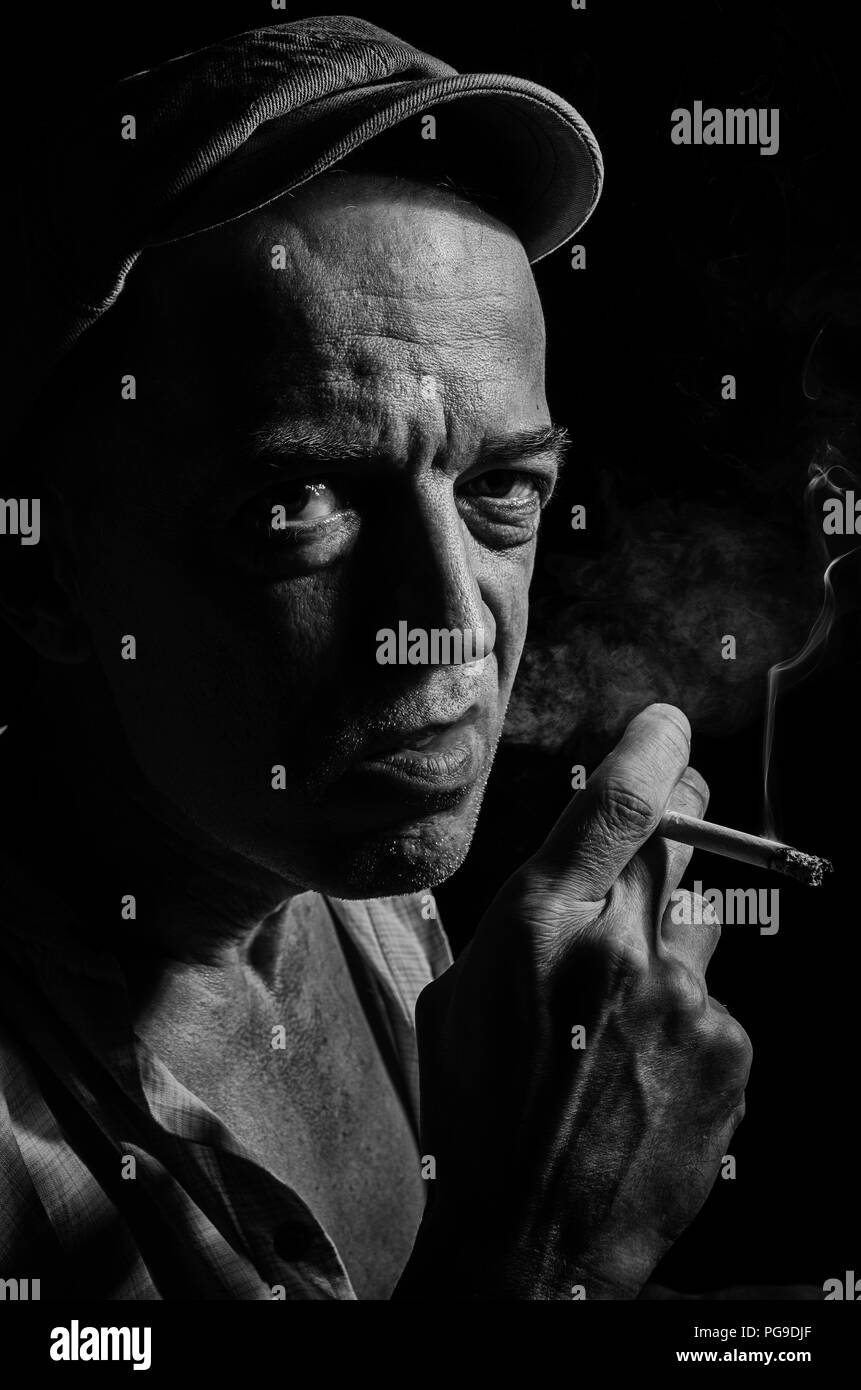 Old Man Smoking Black and White Stock Photos & Images - Alamy
