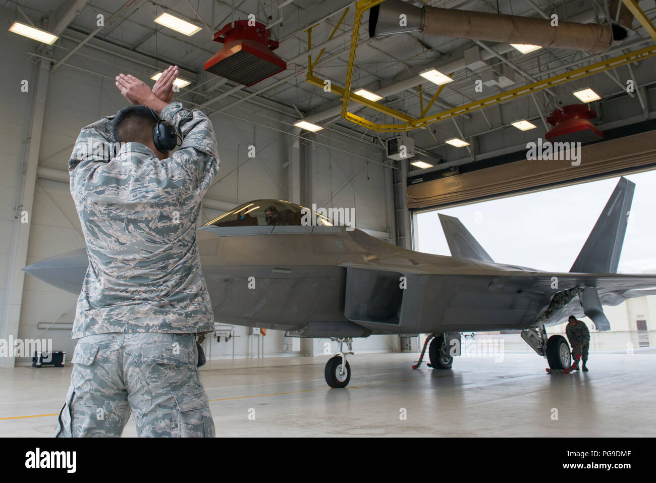 Air Force Senior Airman Roland Reyes, left, a crew chief assigned to ...