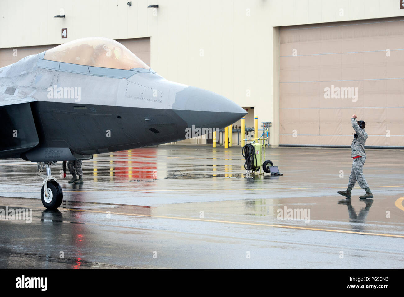Air Force Senior Airman Roland Reyes, right, a crew chief assigned to ...