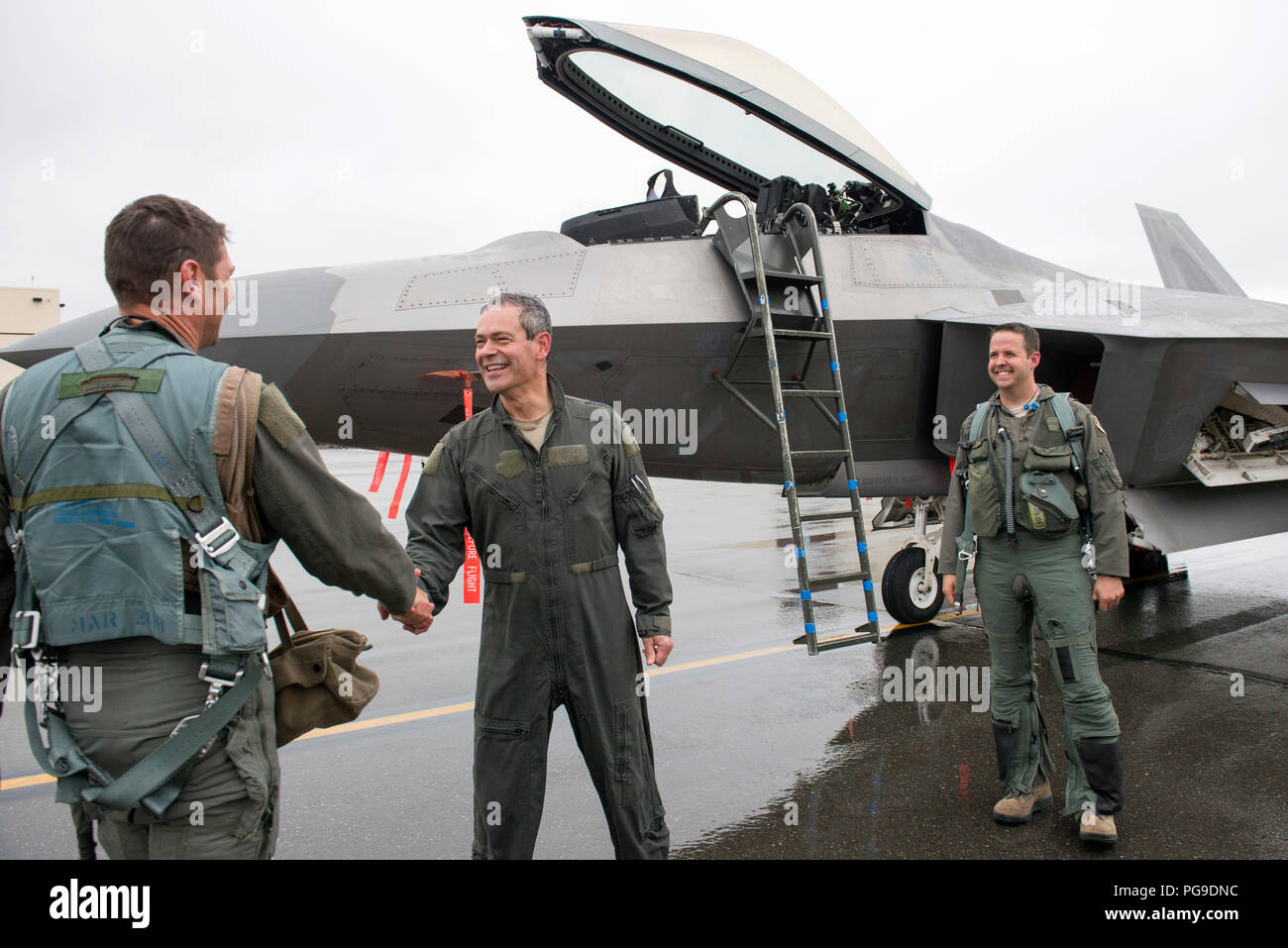 Air Force Lt. Gen. Ken Wilsbach, center, shakes hands with Col. Harlie ...