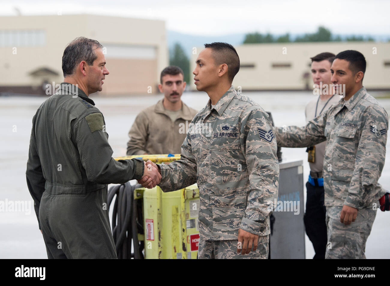 Air Force Lt. Gen. Ken Wilsbach, left, thanks Staff Sgt. Mitchell ...