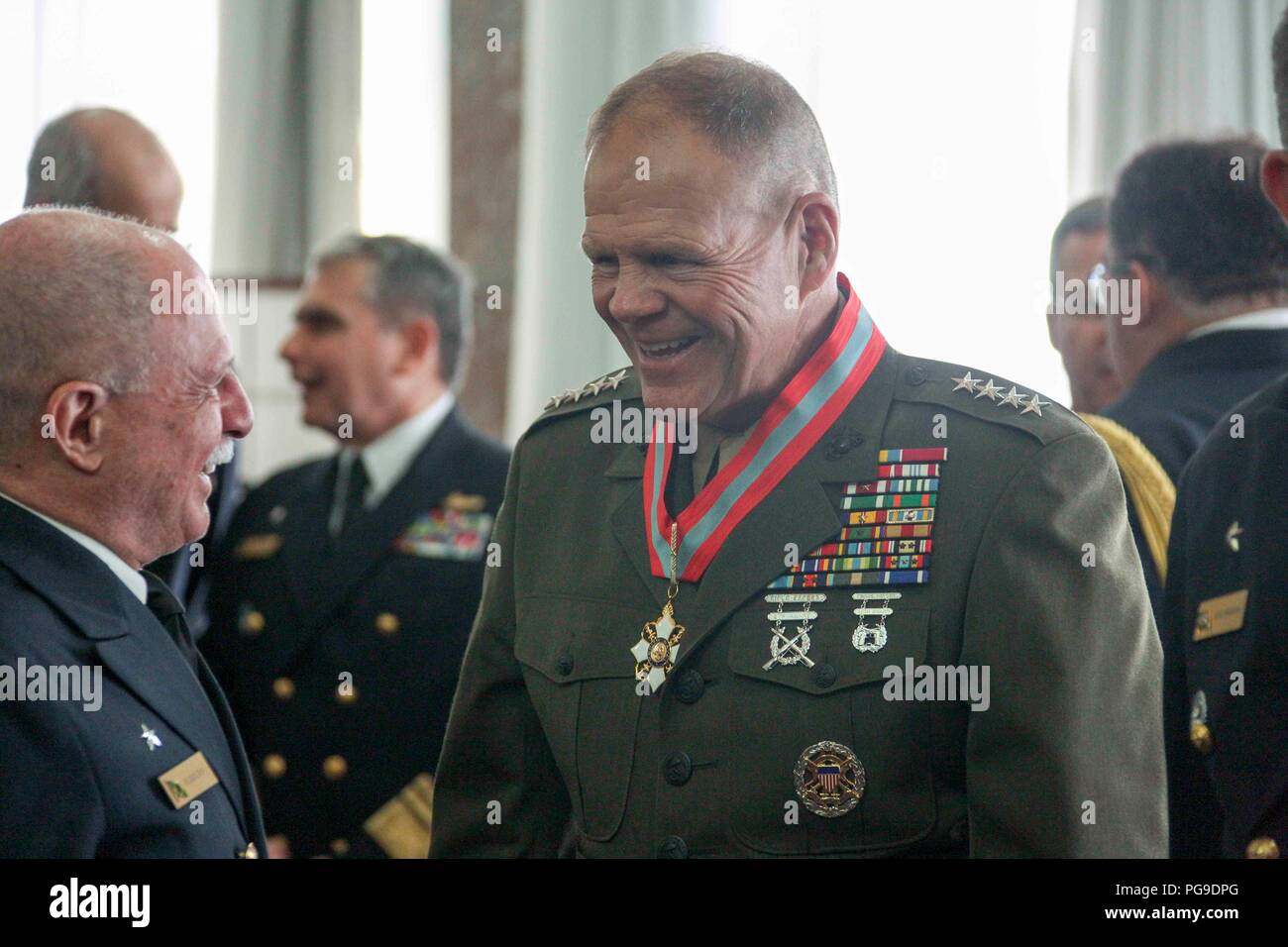 Commandant of the U.S. Marine Corps Gen. Robert B. Neller speaks with a ...
