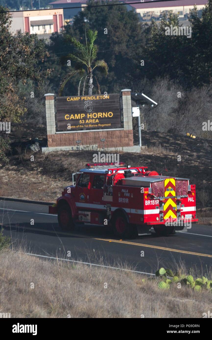 Firefighters with the Camp Pendleton Fire Department and CAL Fire ...