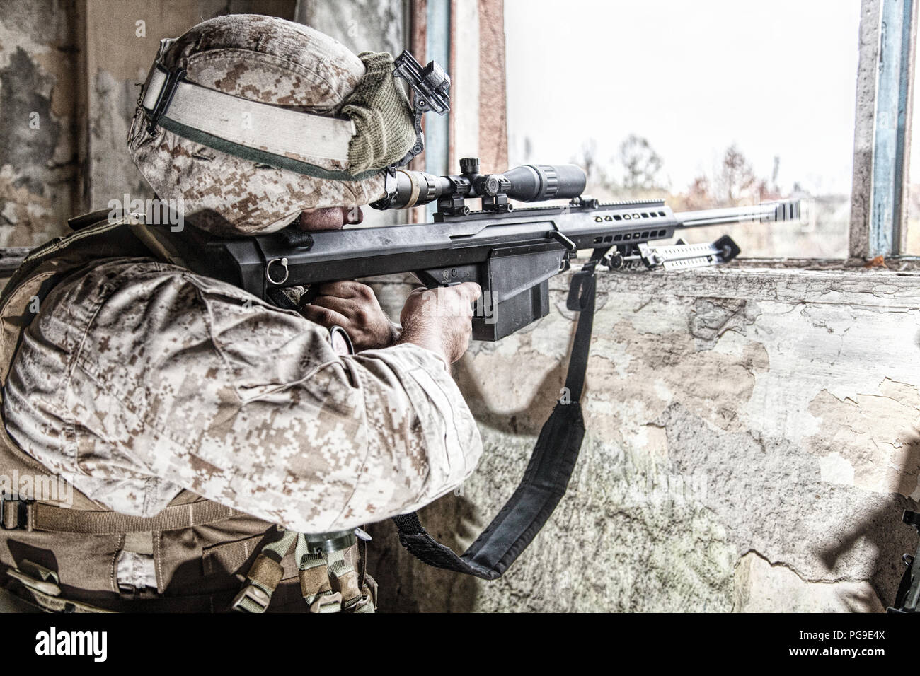 Army sniper shooting with large caliber rifle Stock Photo - Alamy