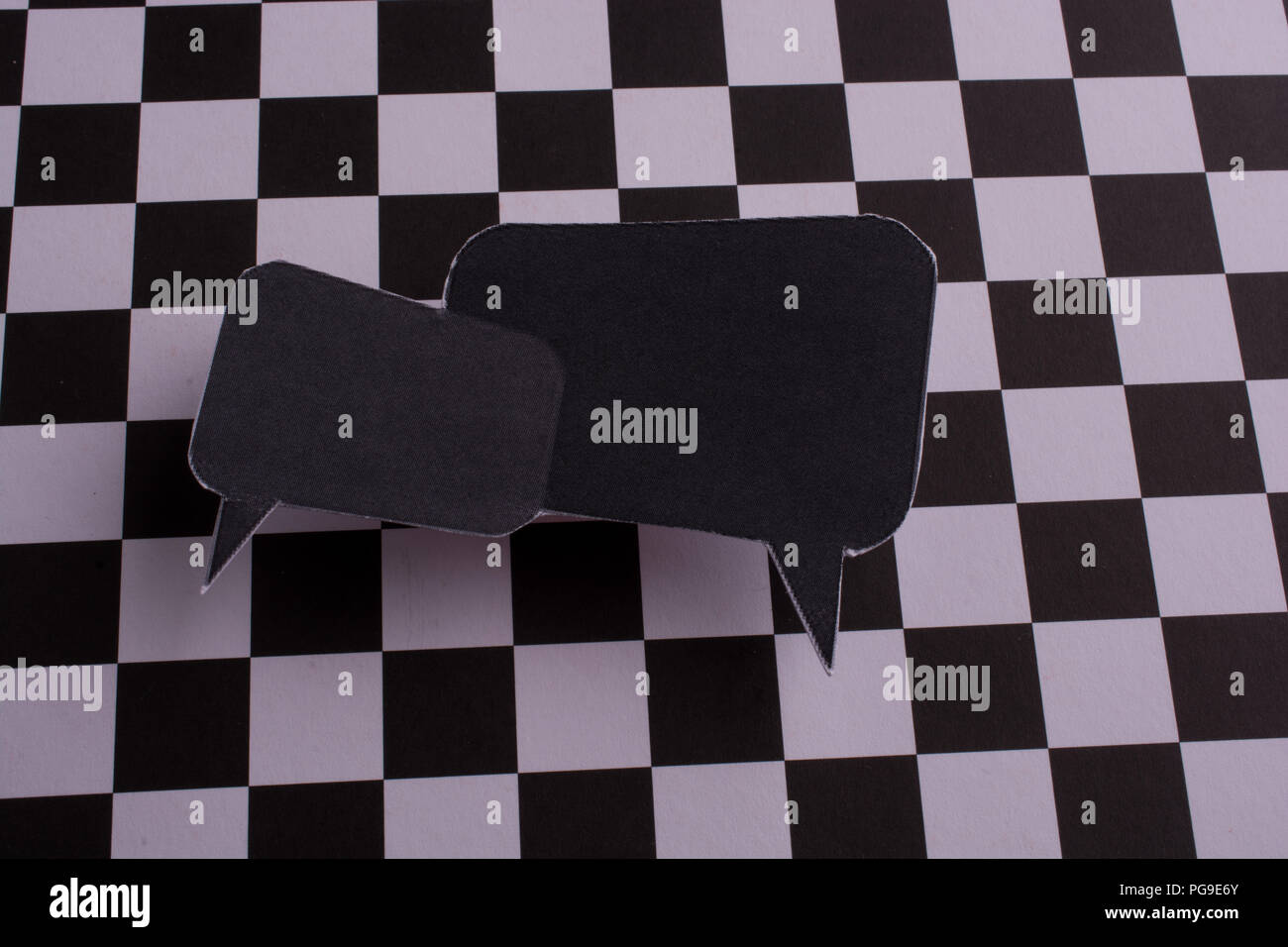 Dialogue boxes on a black and white background Stock Photo - Alamy