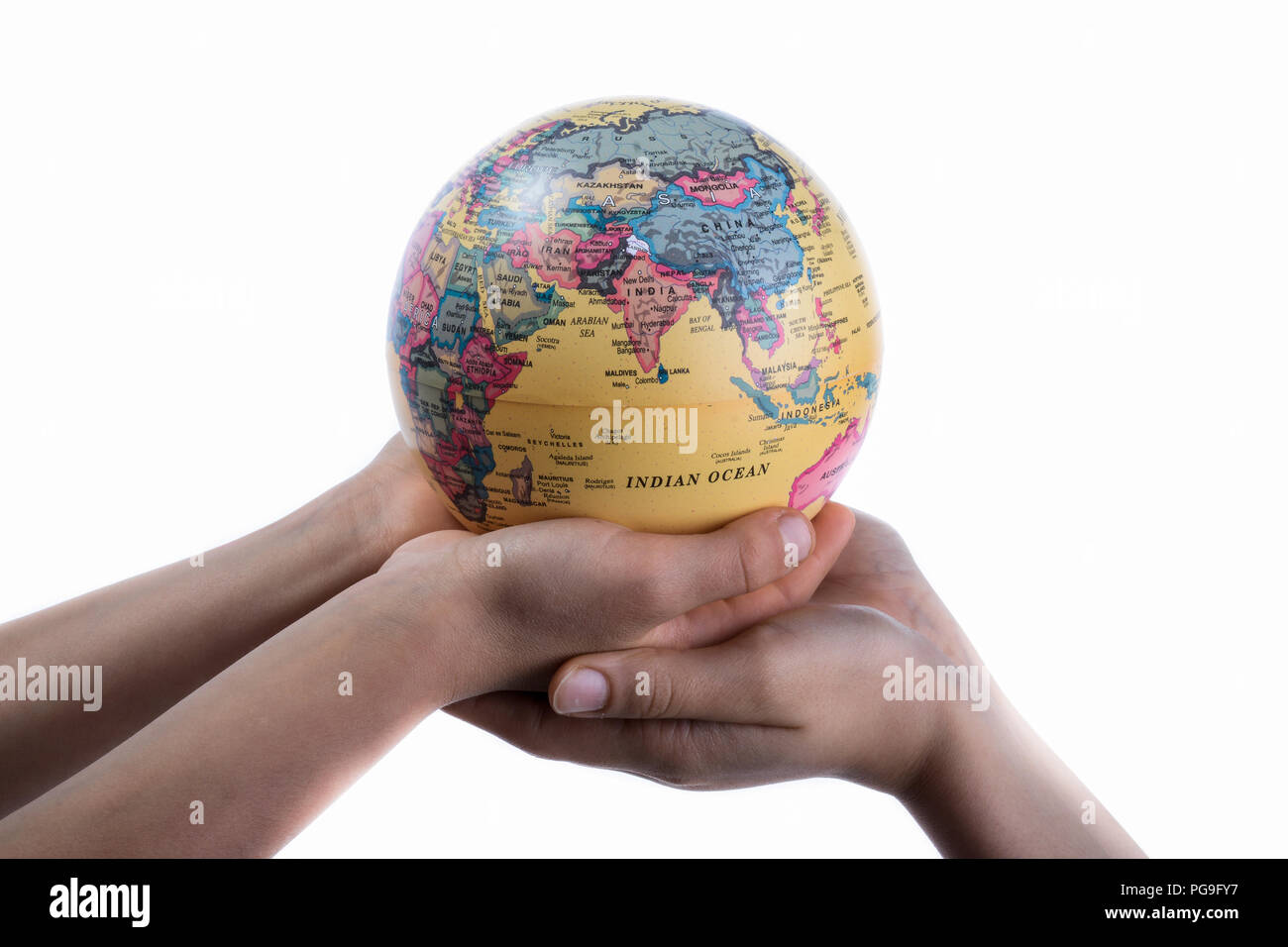 Two hands holding a globe in hand on white background Stock Photo - Alamy