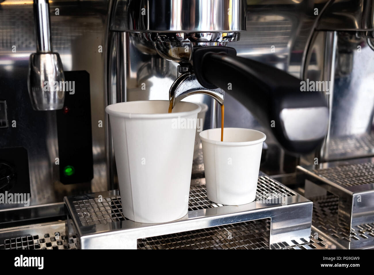 Cups on coffee machine hi-res stock photography and images - Alamy