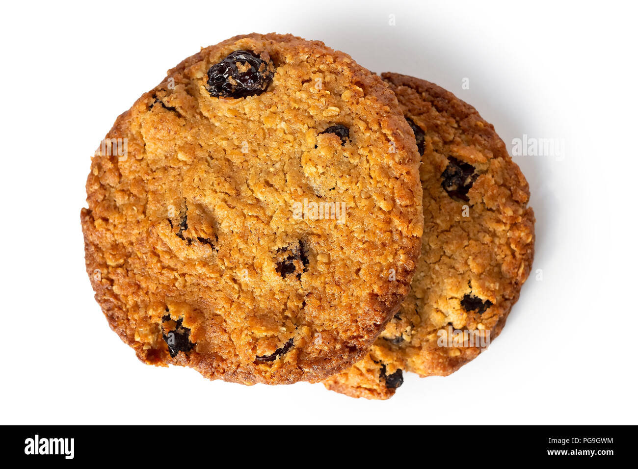 Two oat and raisin round biscuits isolated on white from above Stock ...