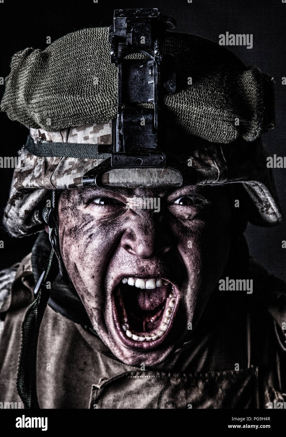 Mad army soldier screaming while looking at camera Stock Photo - Alamy