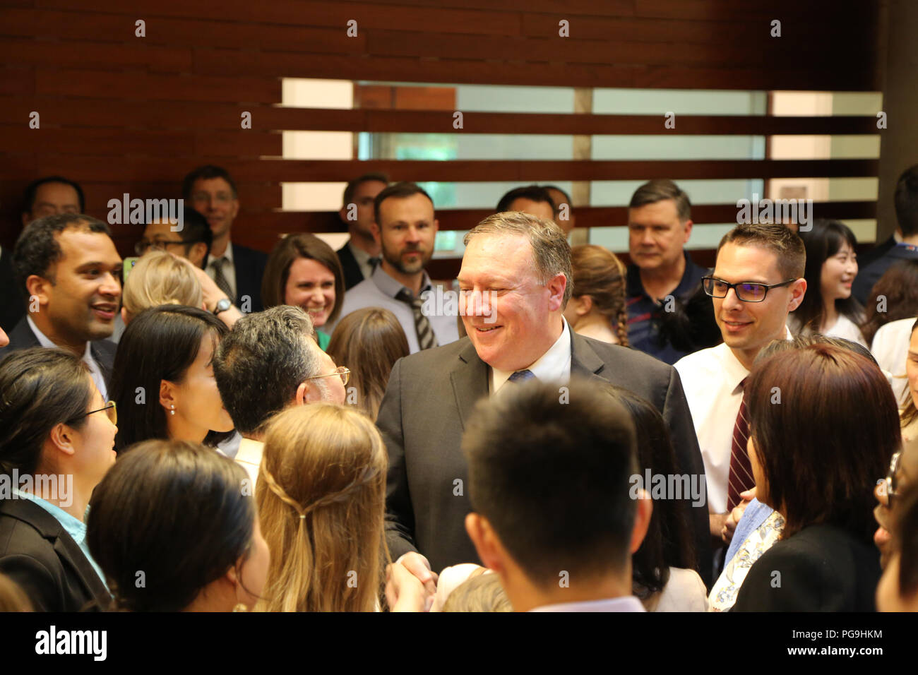 U.S. Secretary of State Mike Pompeo greets embassy personnel and their ...