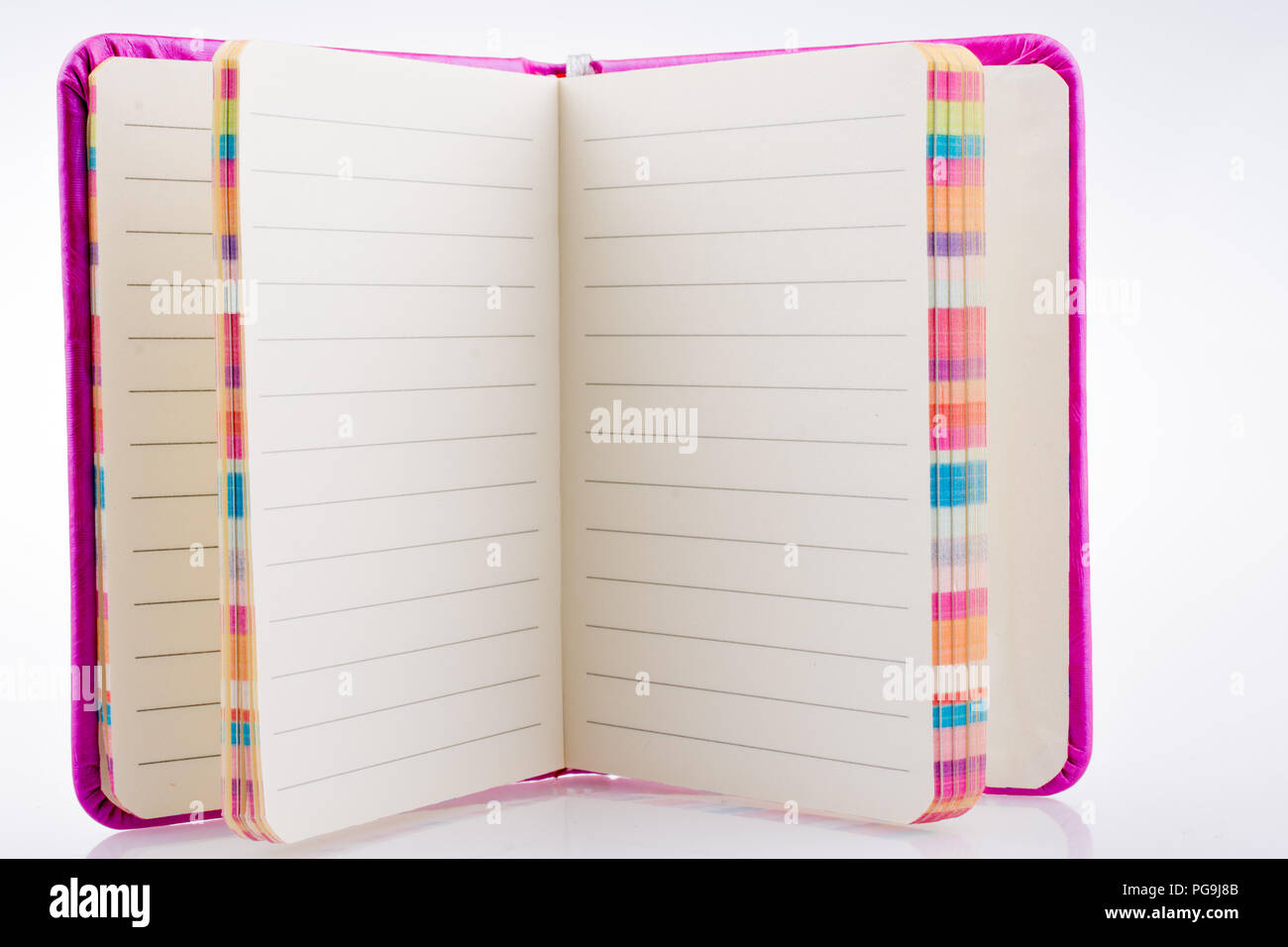 Pink notebook on a white background Stock Photo - Alamy
