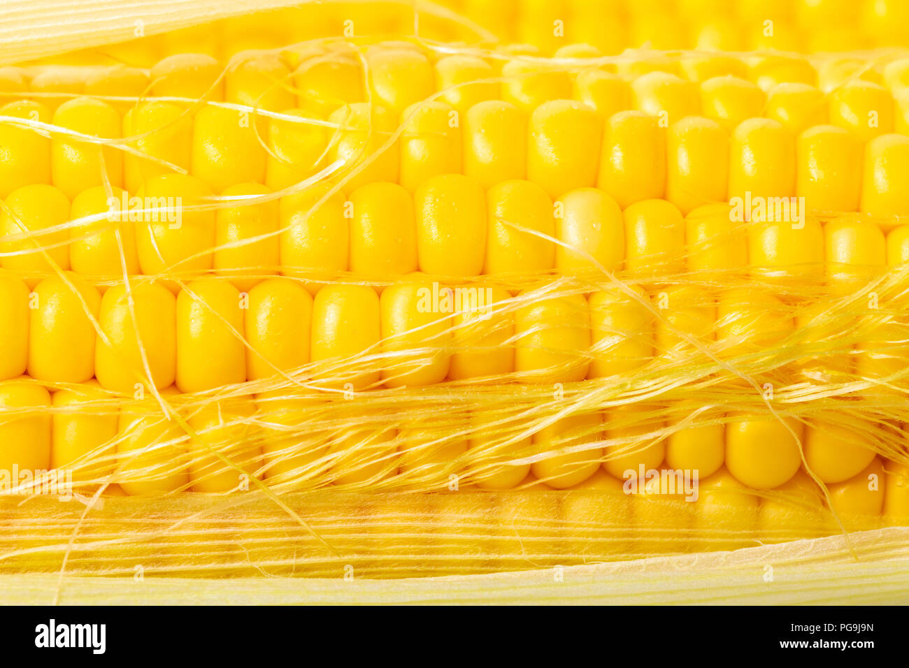 food background of a texture of corn cobs closeup Stock Photo - Alamy