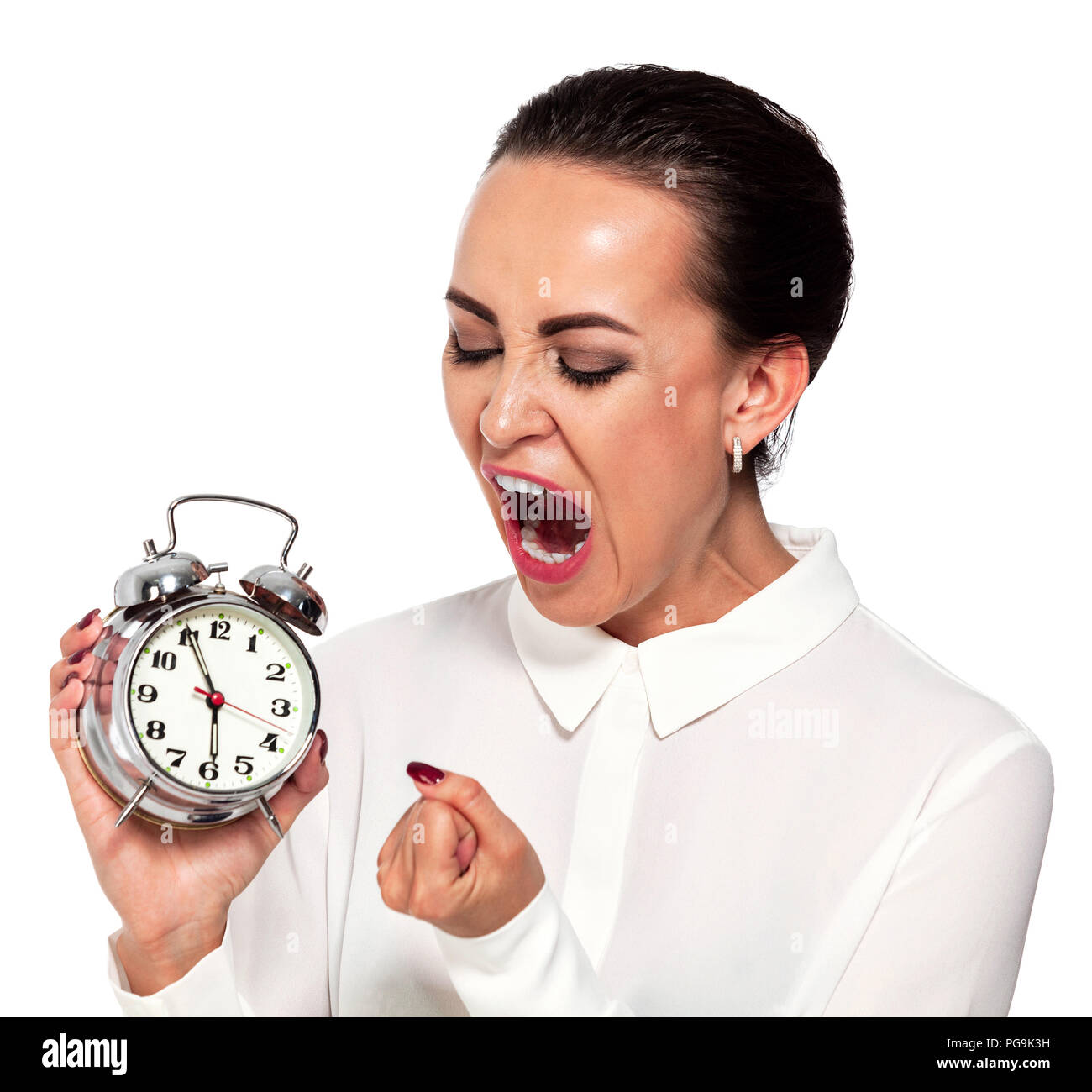 Stressed business woman with an alarm clock, isolated on white ...