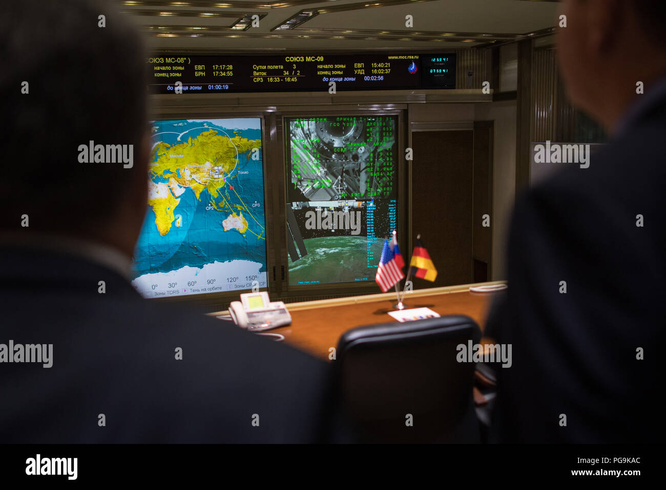 Guests watch a live view of the International Space Station, as seen by ...