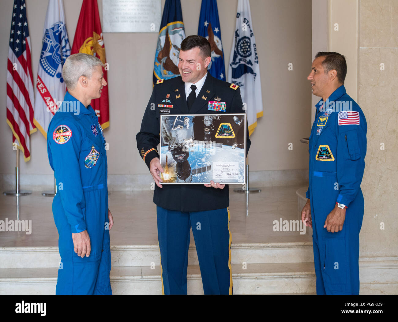 NASA astronauts Mark Vande Hei, left, and Joe Acaba, right, present ...