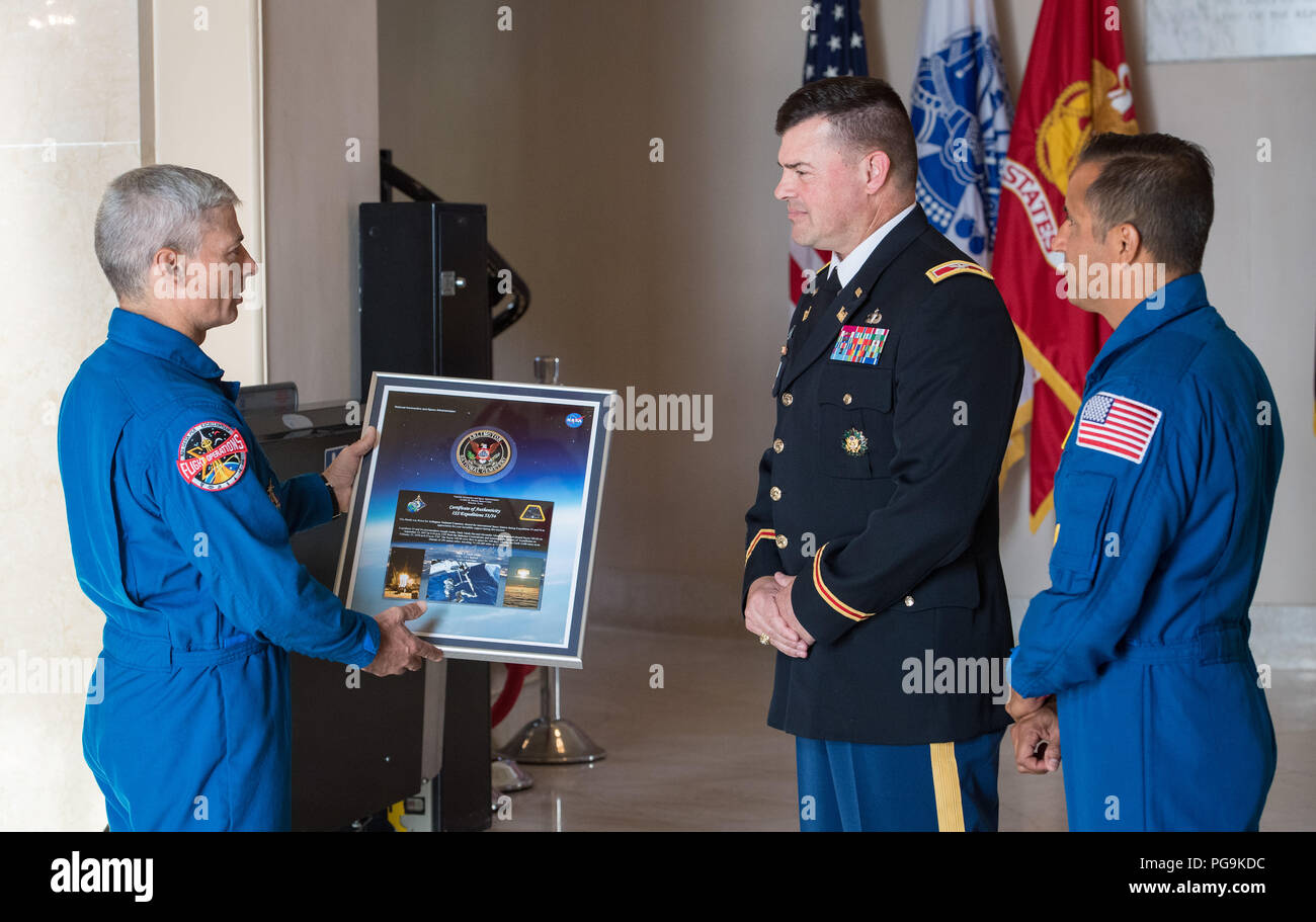 NASA astronauts Mark Vande Hei, left, and Joe Acaba, right, present ...