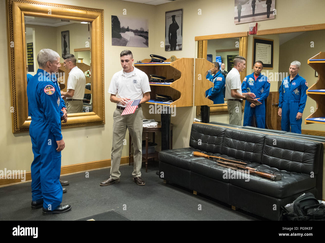 NASA astronauts Mark Vande Hei, left, and Joe Acaba, center, listen as ...