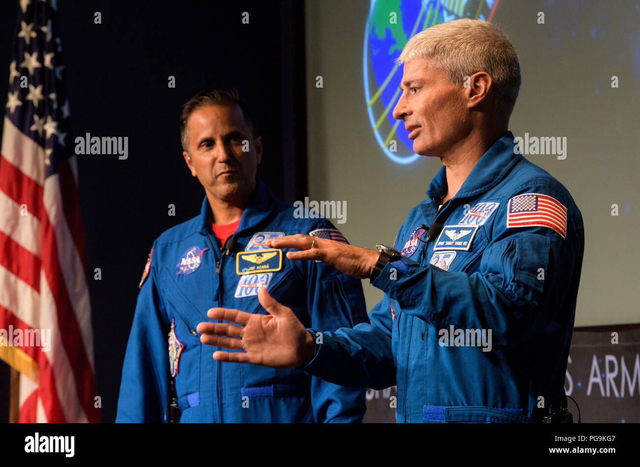 NASA astronauts Joe Acaba, left, and Mark Vande Hei, right, answer ...