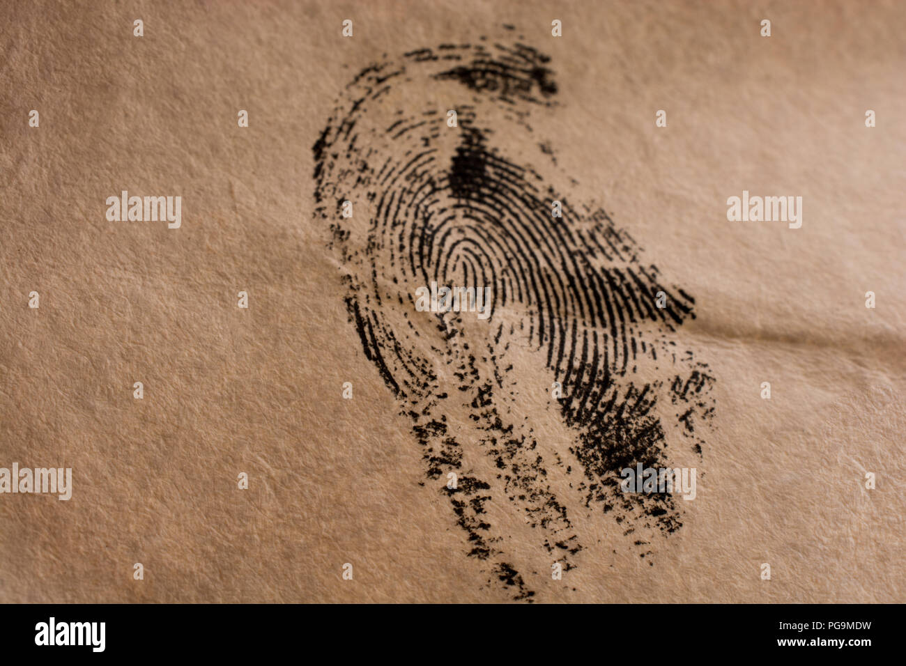 Fingerprint on a brown paper Stock Photo - Alamy