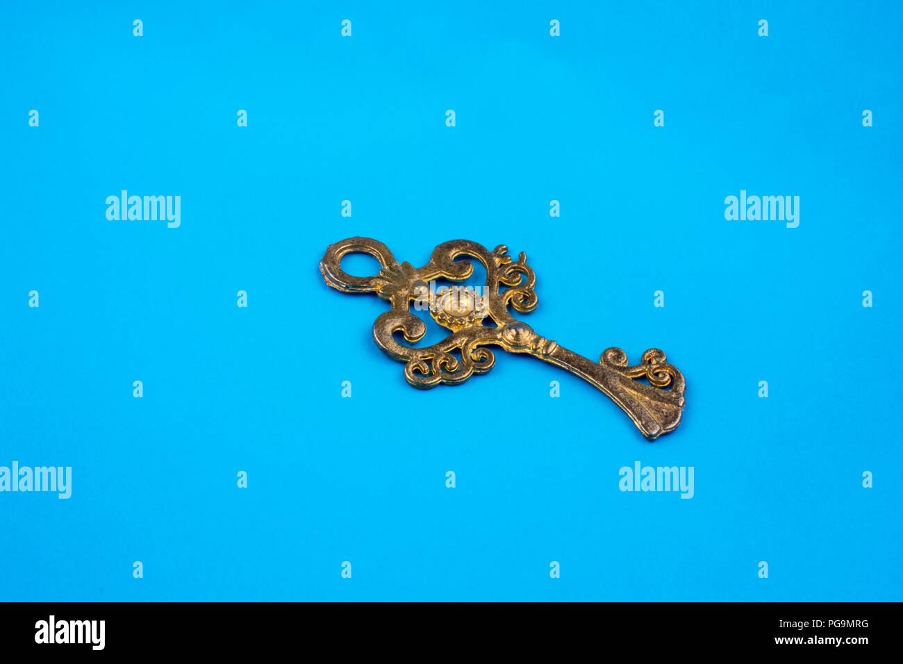 Retro styled key in water in blue background Stock Photo - Alamy