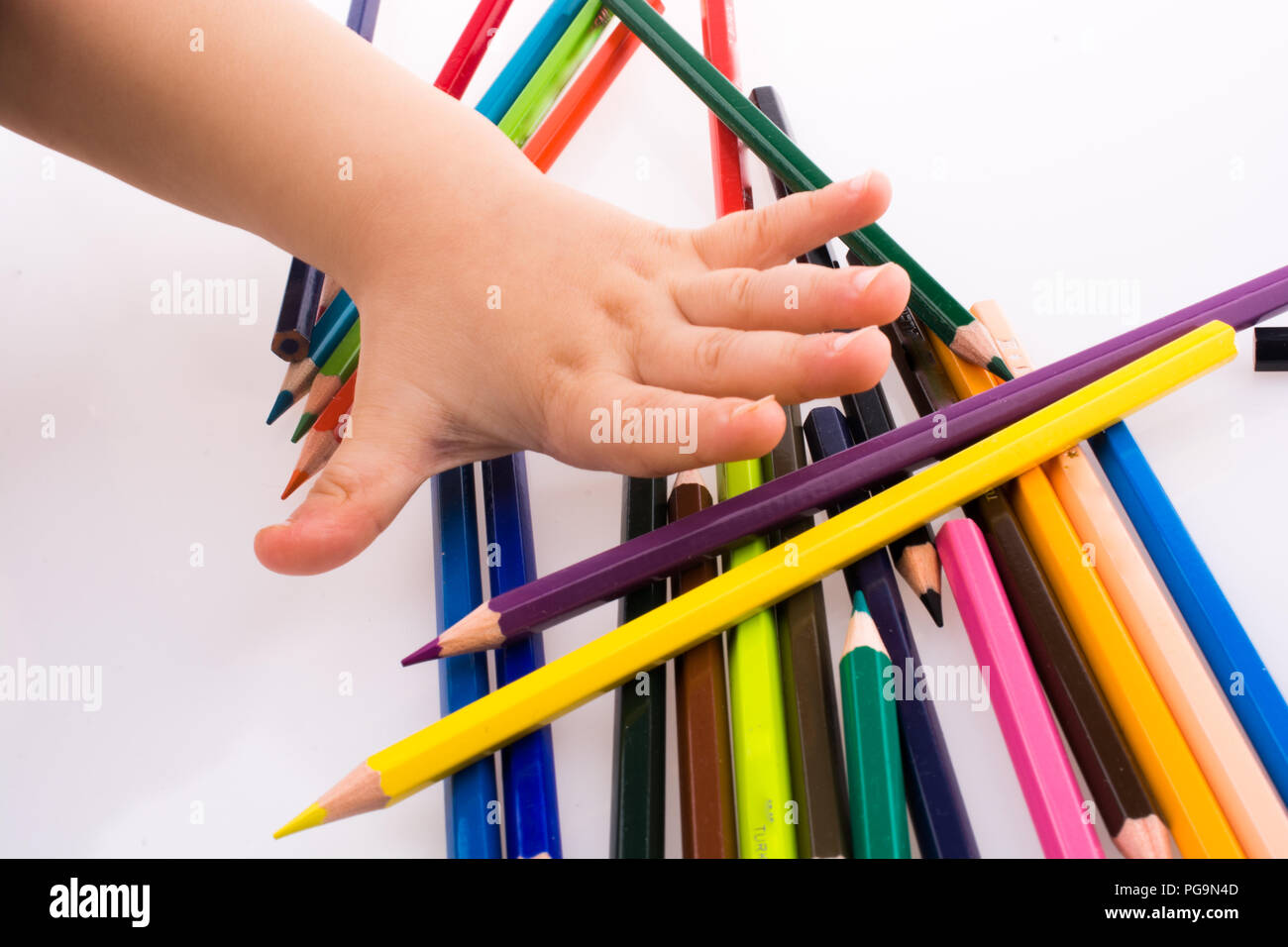 Hand holding Color pencils on a white background Stock Photo - Alamy