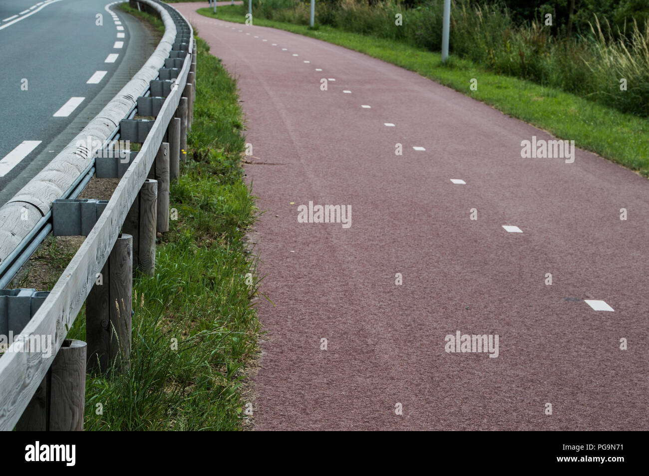 Empty Bicycle Path Along A Road Stock Photo - Alamy