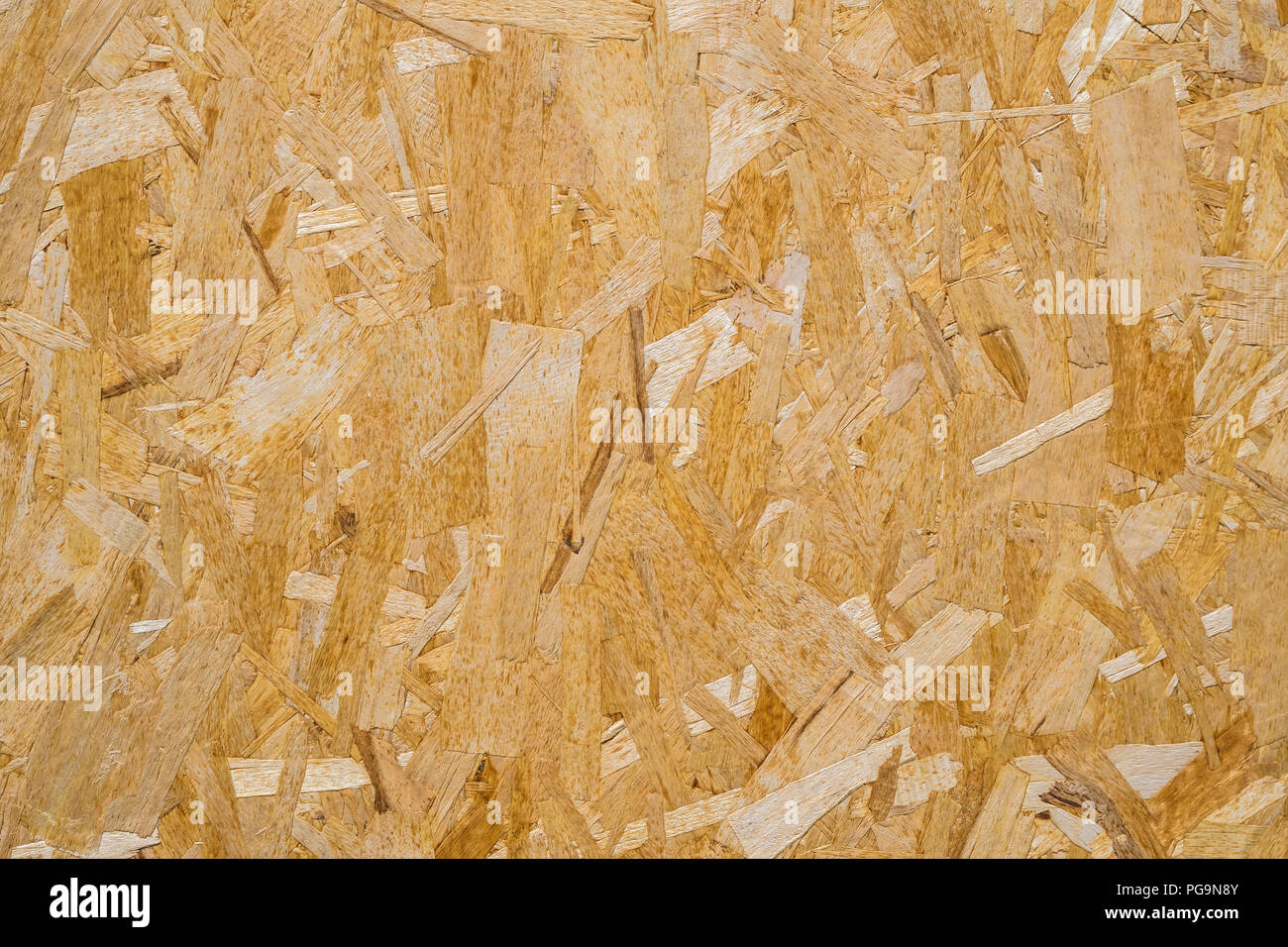 close up pressed wooden panel background, seamless texture of oriented strand board - OSB wood ...