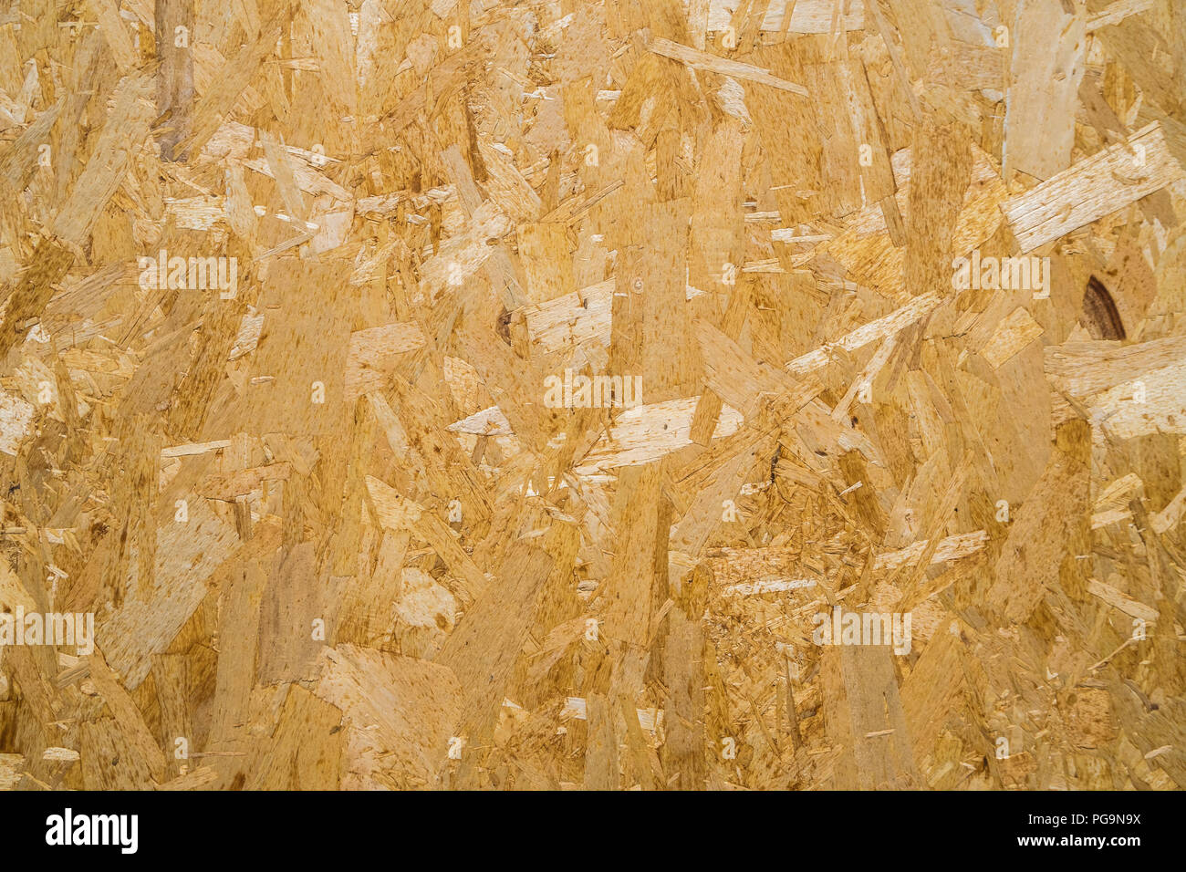 close up pressed wooden panel background, seamless texture of oriented strand board - OSB wood ...