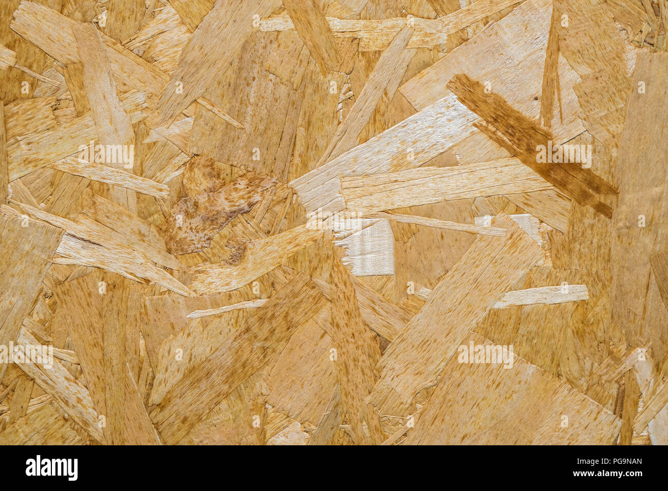 close up pressed wooden panel background, seamless texture of oriented strand board - OSB wood ...