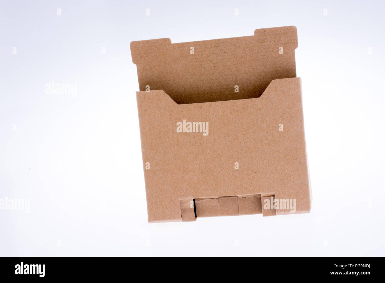 Hand reaches paper holder stand on white background Stock Photo - Alamy