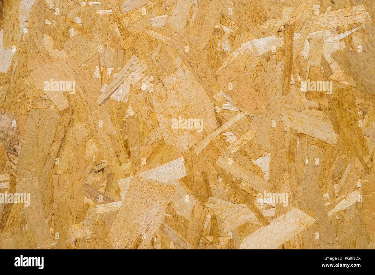 close up pressed wooden panel background, seamless texture of oriented strand board - OSB wood ...
