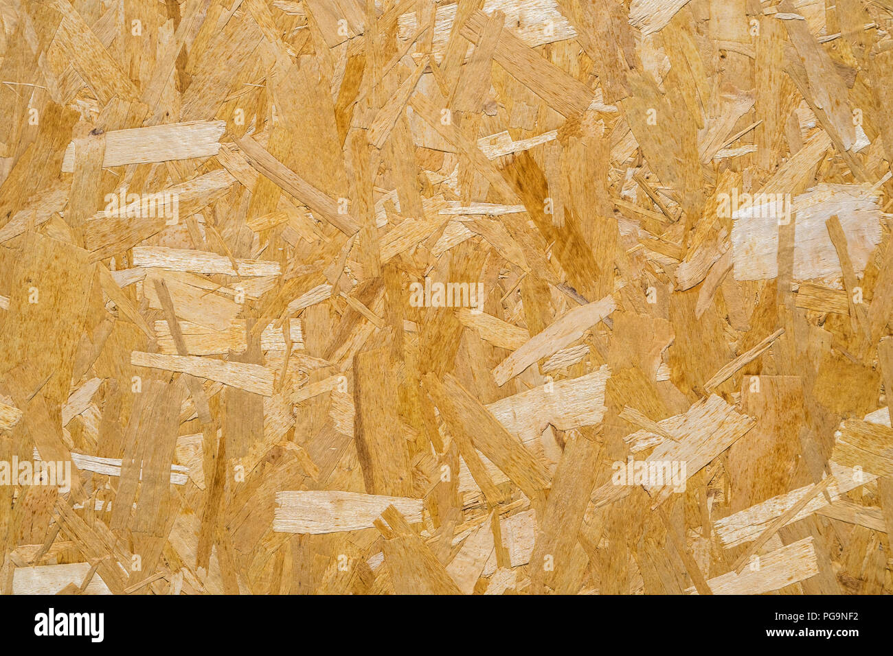 close up pressed wooden panel background, seamless texture of oriented strand board - OSB wood ...